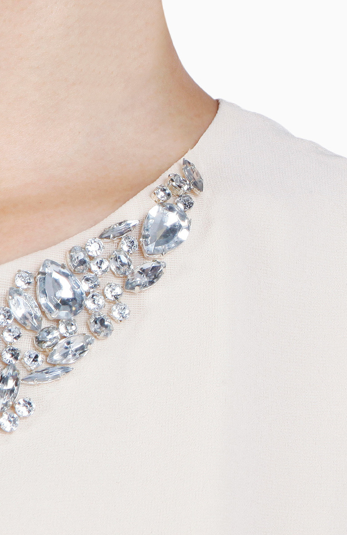 Sleeveless Bejeweled collar top in Beige | DAILYLOOK